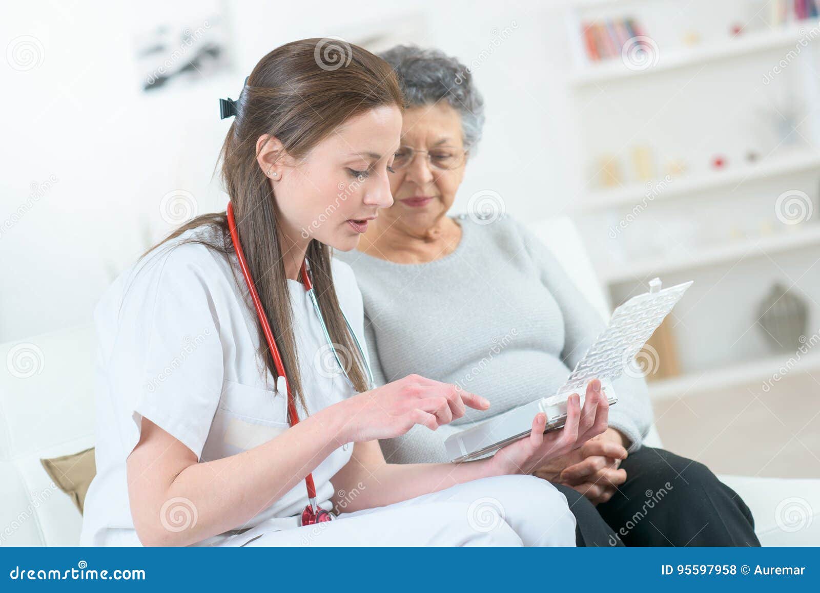 Smiling Elderly Lady with Supportive Doctor Stock Photo - Image of news ...