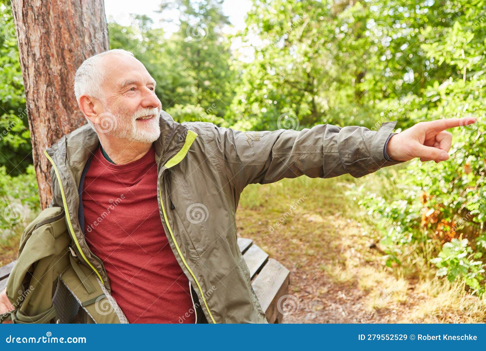 Smiling Elderly Man Pointing while Exploring Forest in Vacation Stock ...