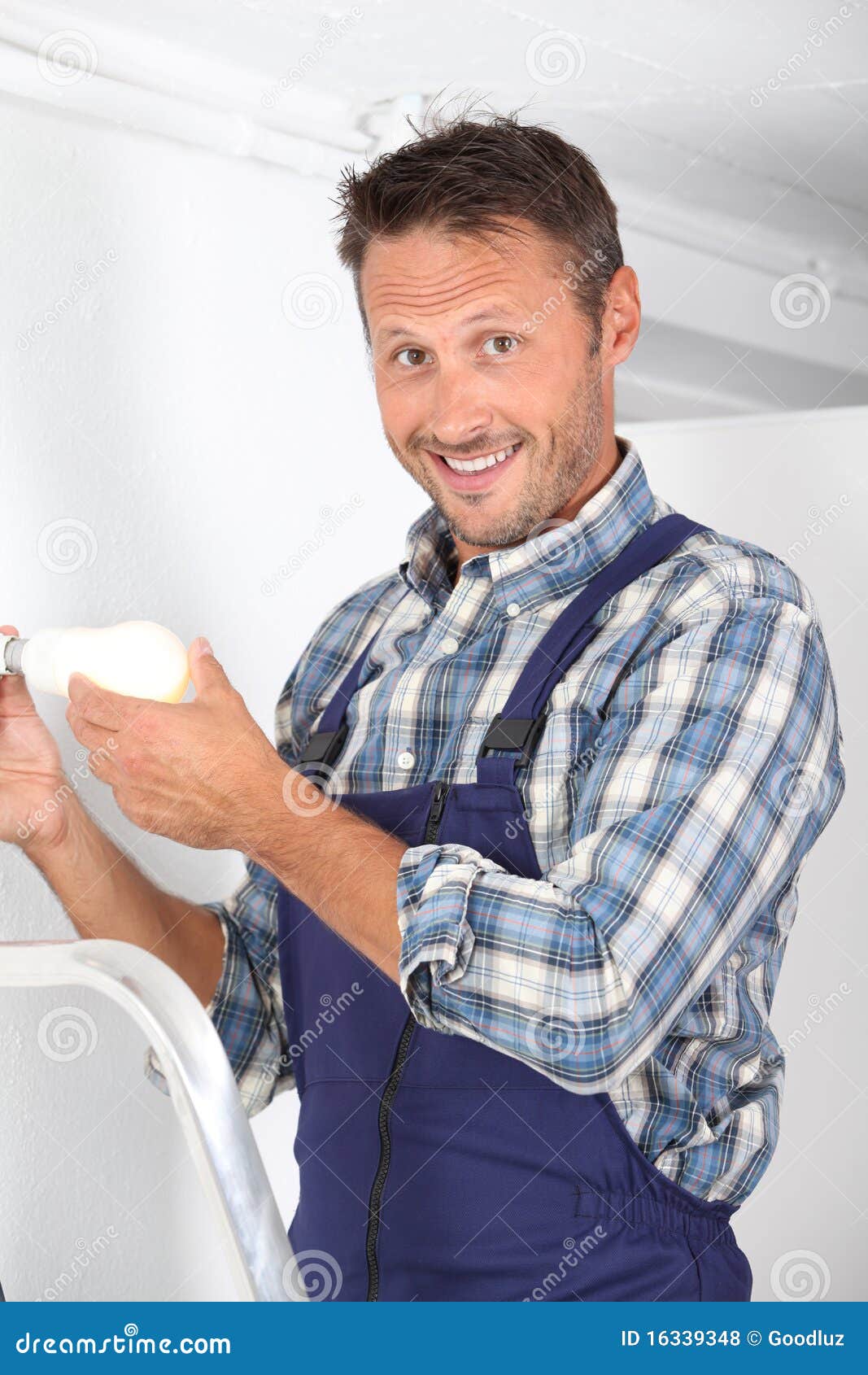 Smiling electrician stock photo. Image of bulb, happy - 16339348