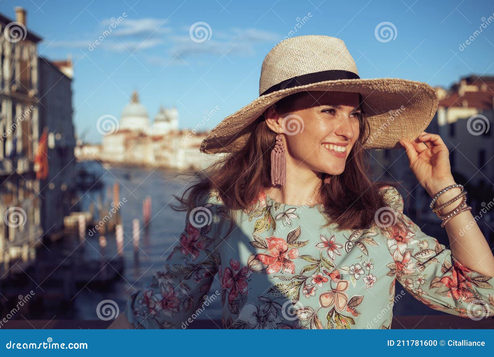 Smiling Elegant Woman in Floral Dress Having Walking Tour Stock Photo ... Smiling Elegant Woman in Floral Dress Having Walking Tour Stock Photo ...