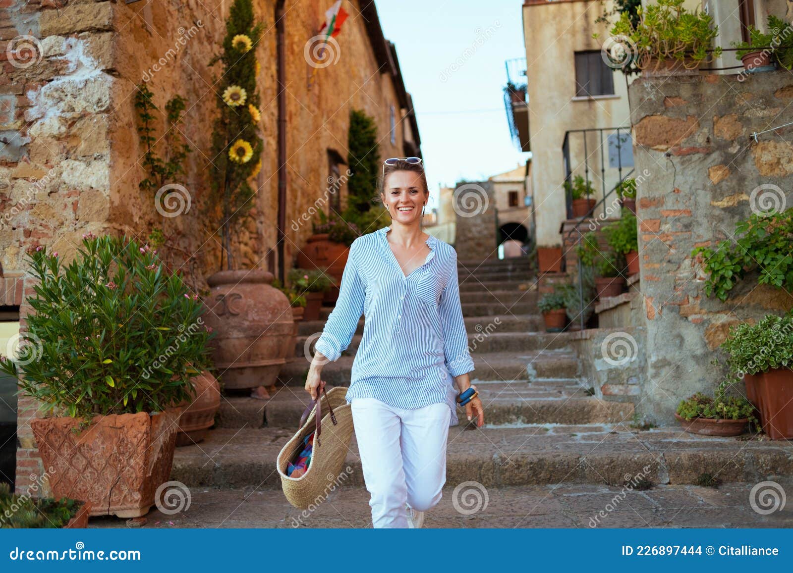 Smiling Elegant Woman Having Walking Tour in Tuscany, Italy Stock Photo ... Smiling Elegant Woman Having Walking Tour in Tuscany, Italy Stock Photo ...