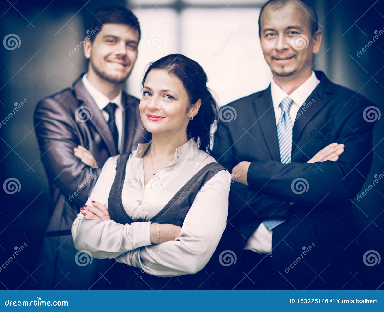Smiling Employees Standing Behind Each Other in Office Stock Photo ...