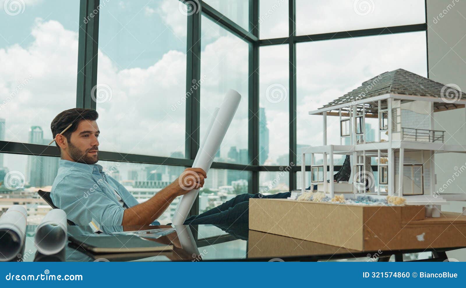 Smiling Engineer Looking Project Plan while Design House Model. Tracery ...