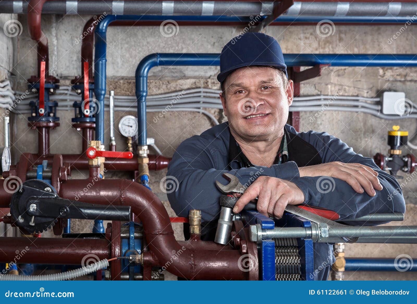 Smiling engineer plumber. stock image. Image of heating - 61122661