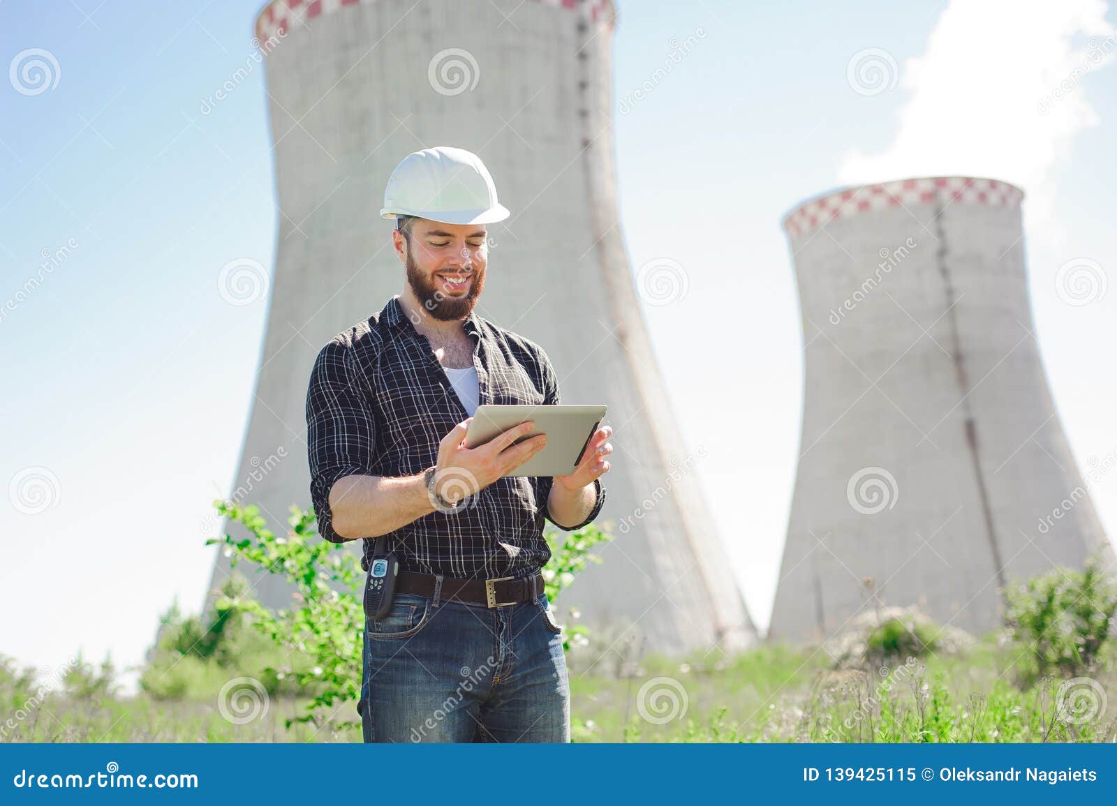 Smiling Engineer Using a Tablet in a Facility. Stock Image - Image of ...