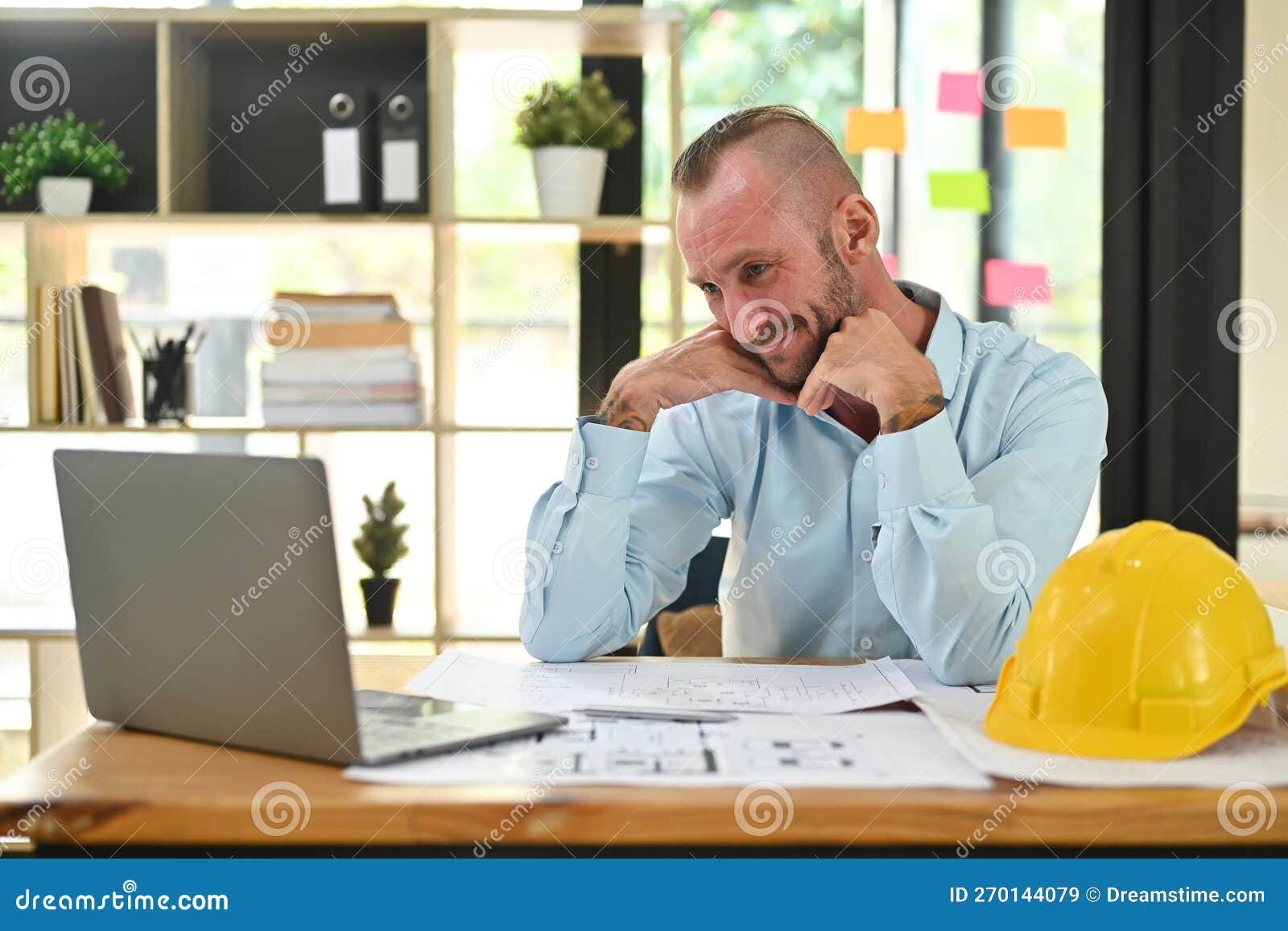 Smiling Engineers Man Looking at Laptop Screen while Working with ...