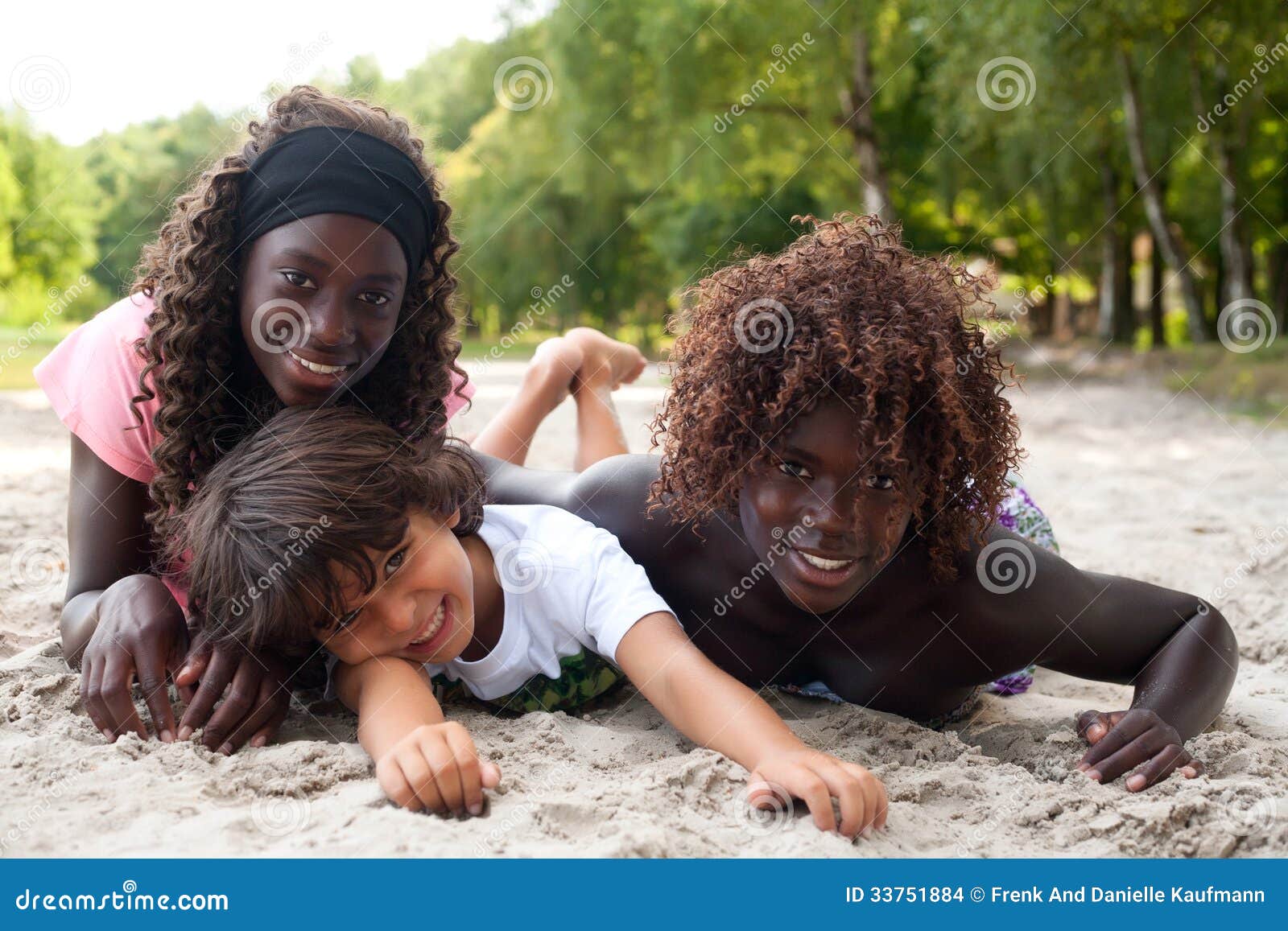 Smiling Ethnic Children on the Beach Stock Photo - Image of black ...
