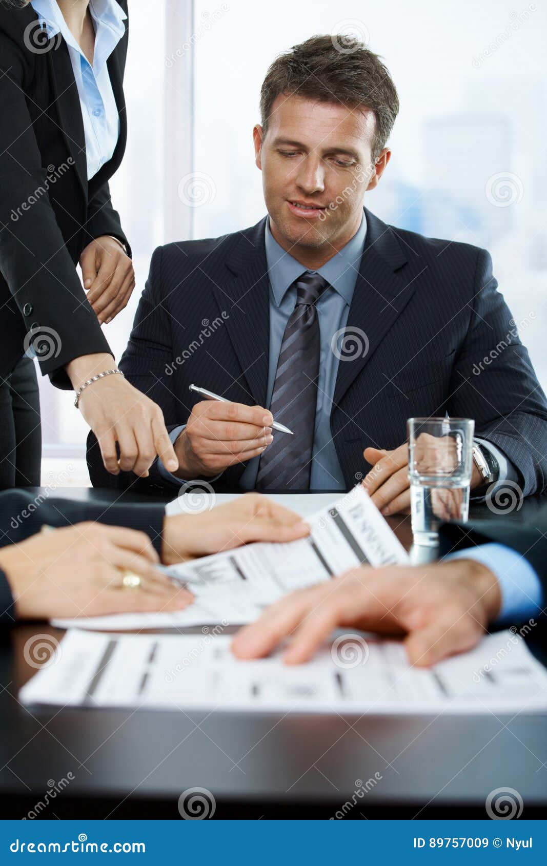 Smiling Executive Signing Contract Stock Image - Image of blond, adult ...