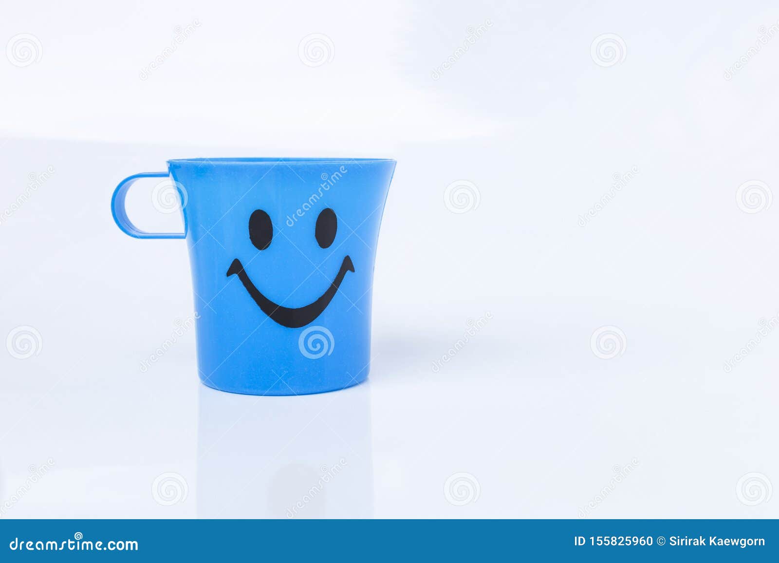 Smiling Face on Blue Plastic Cup on White Background Stock Photo ...