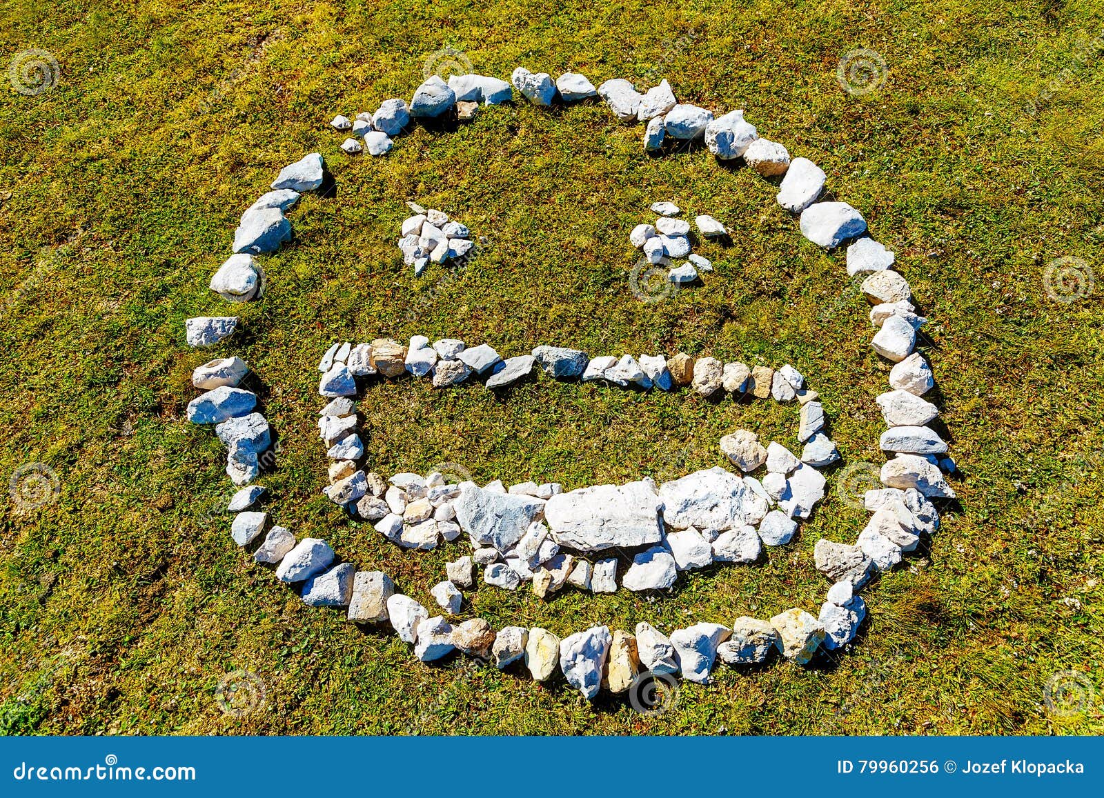 Smiling Face Icon Made of Pebble Stones on Mountain Meadow Stock Photo ...