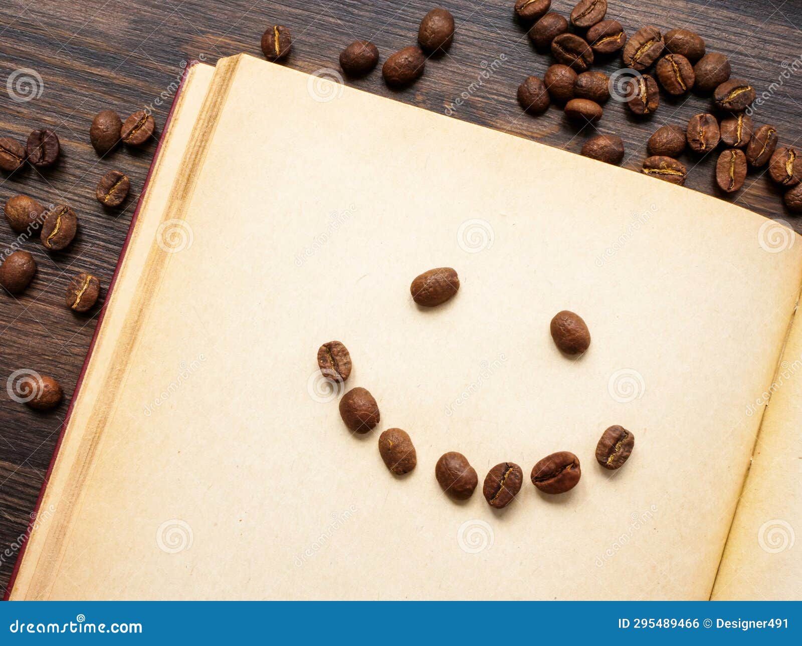 Smiling Face Made of Coffee Beans on an Open Book. Energy and ...