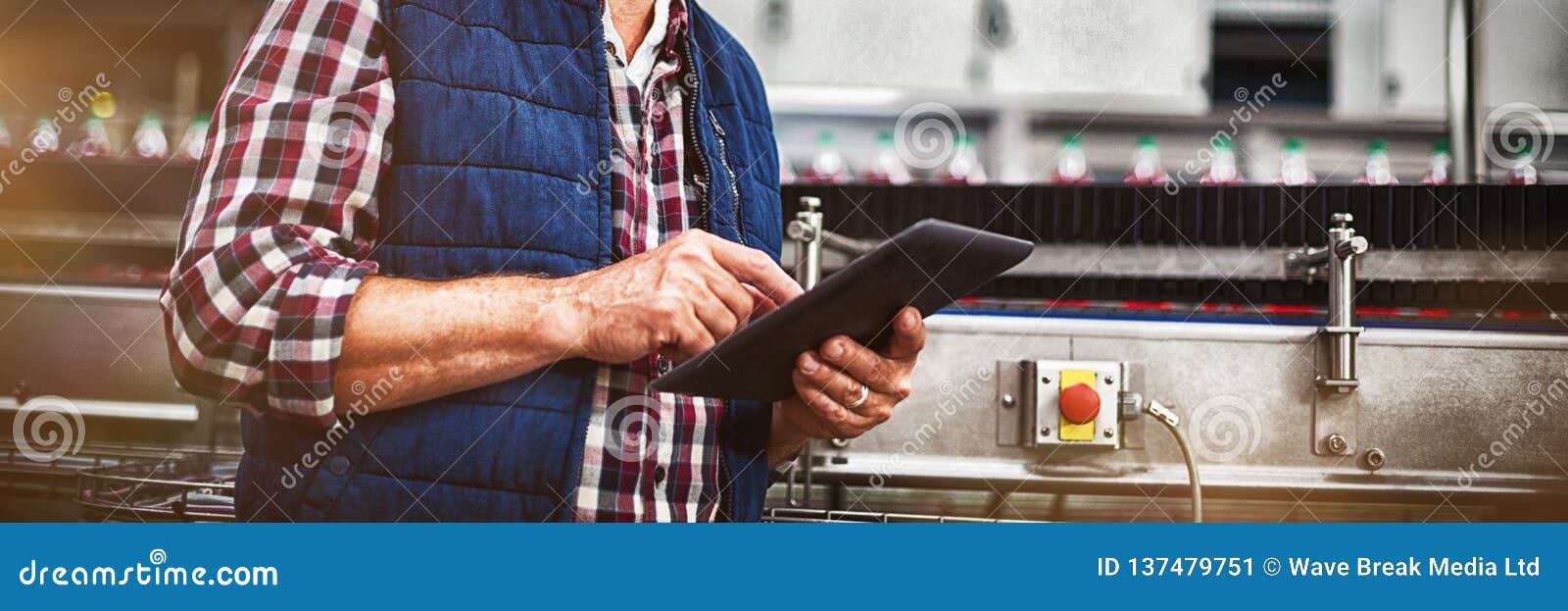 Smiling Factory Worker Using Digital Tablet in the Factory Stock Image ...