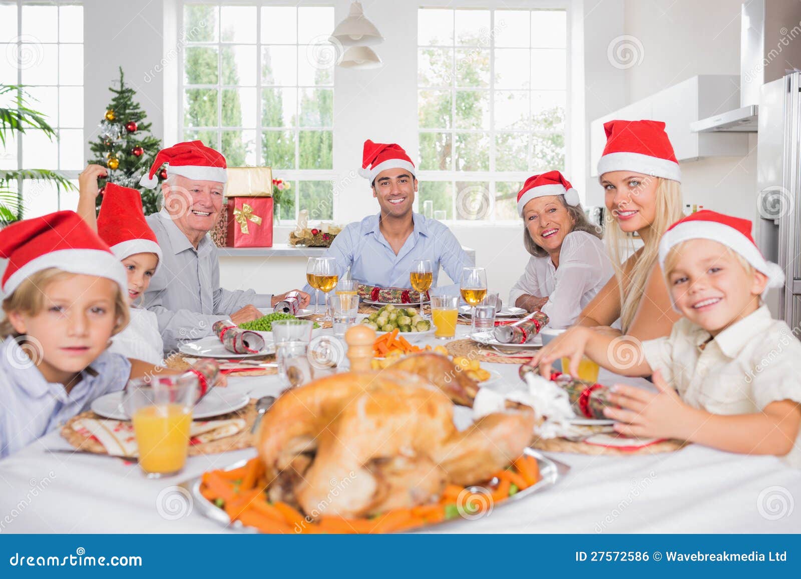 Smiling Family Around The Dinner Table Royalty Free Stock Image - Image ...