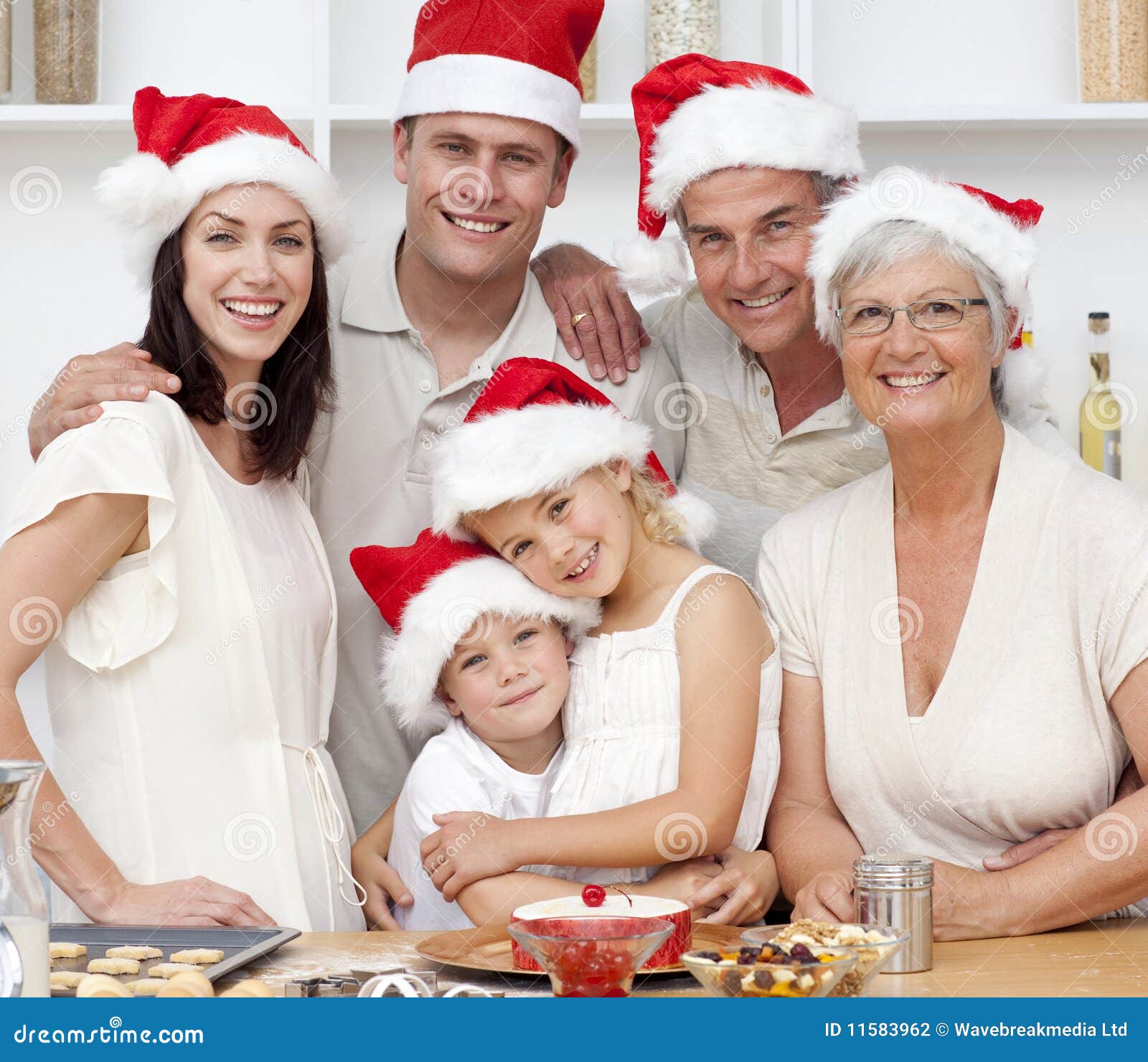 Smiling Family Baking Christmas Cakes Stock Photo - Image of ...