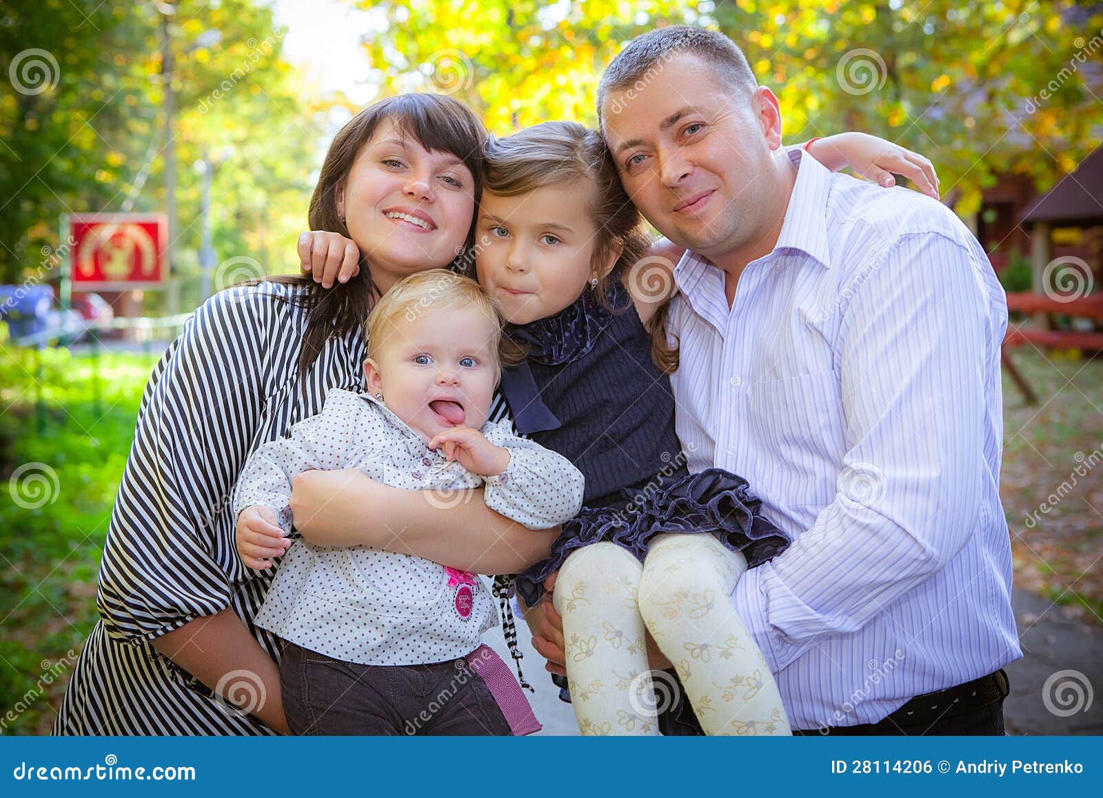 Smiling Family with Children Outdoors Stock Photo - Image of looking ...
