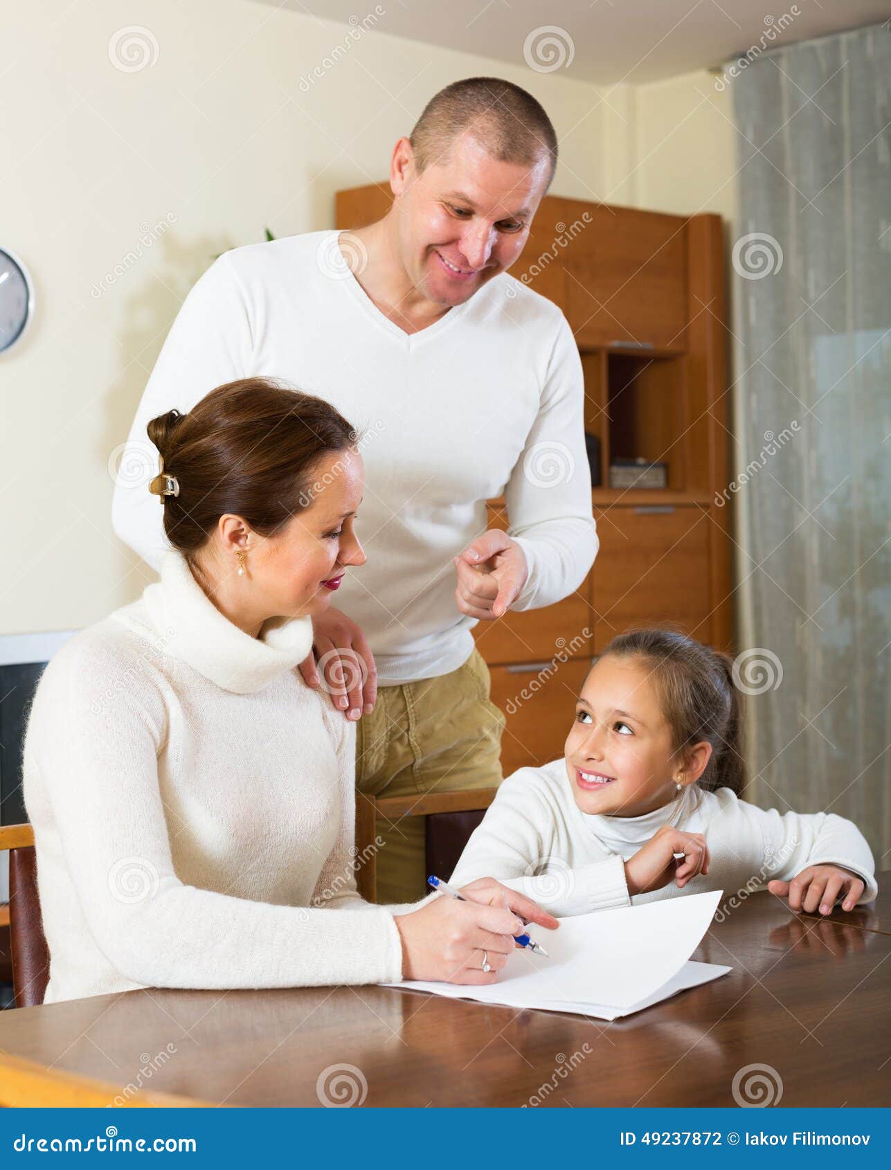 Smiling Family with Documents Stock Photo - Image of father, girl: 49237872