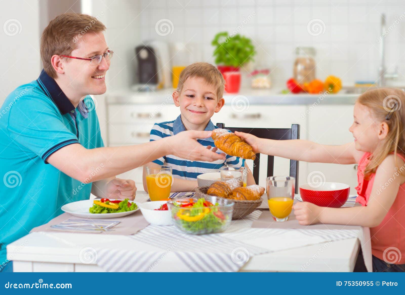 Smiling Family Eating Breakfast in Kitchen Stock Image - Image of ...