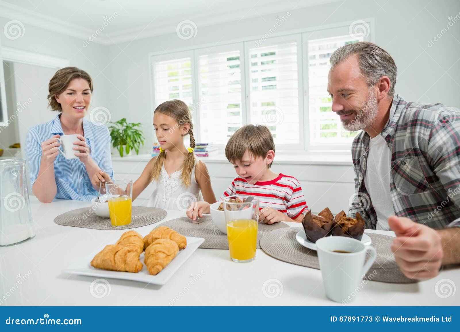 Smiling Family Having Breakfast in the Kitchen Stock Image - Image of ...