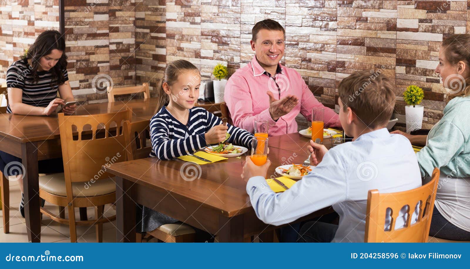 Family dining and talking stock photo. Image of europeans - 204258596
