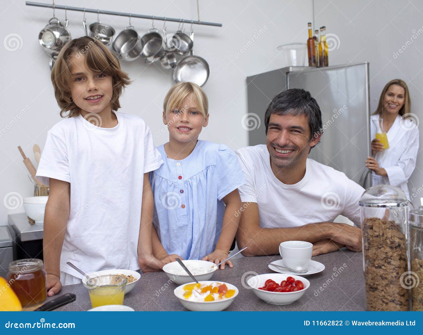 Smiling Family Preparing Breakfast Stock Photo - Image of cheerful ...