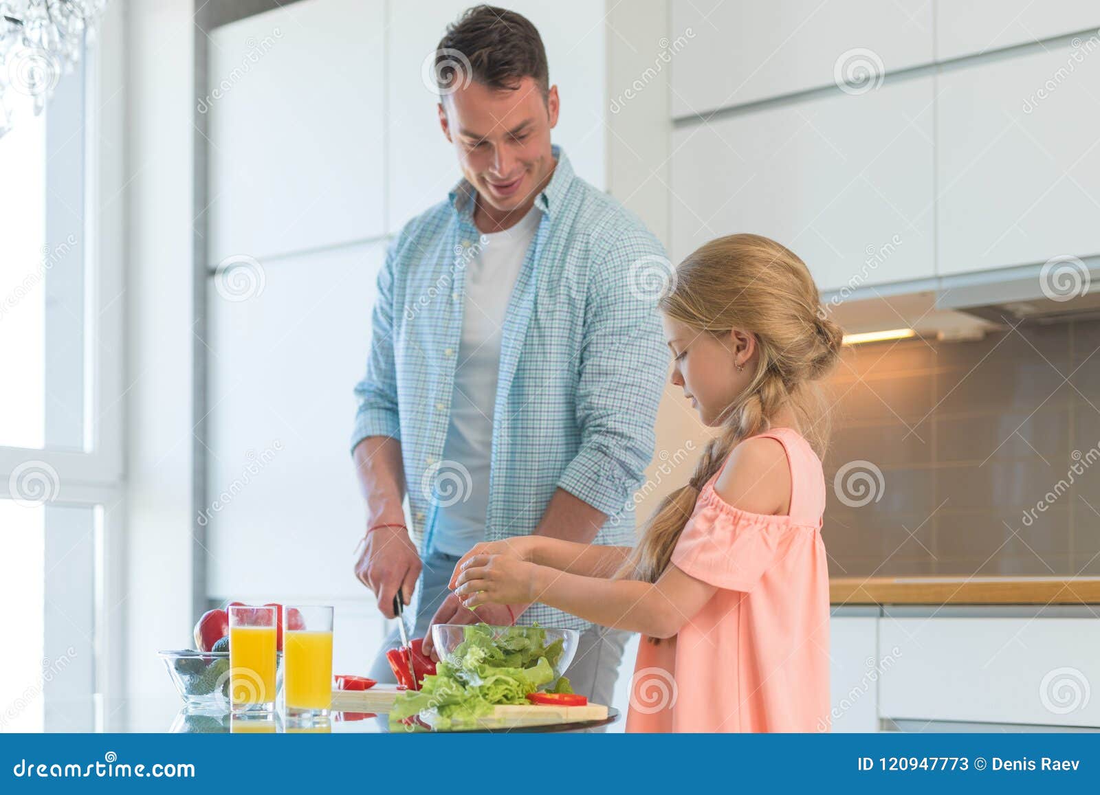 Smiling Family with a Child in the Kitchen Stock Image - Image of ...