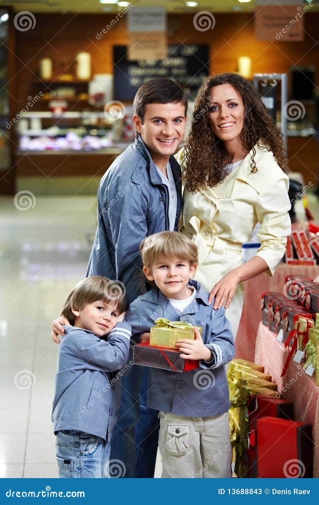 Smiling family in shop stock image. Image of adults, domestic - 13688843