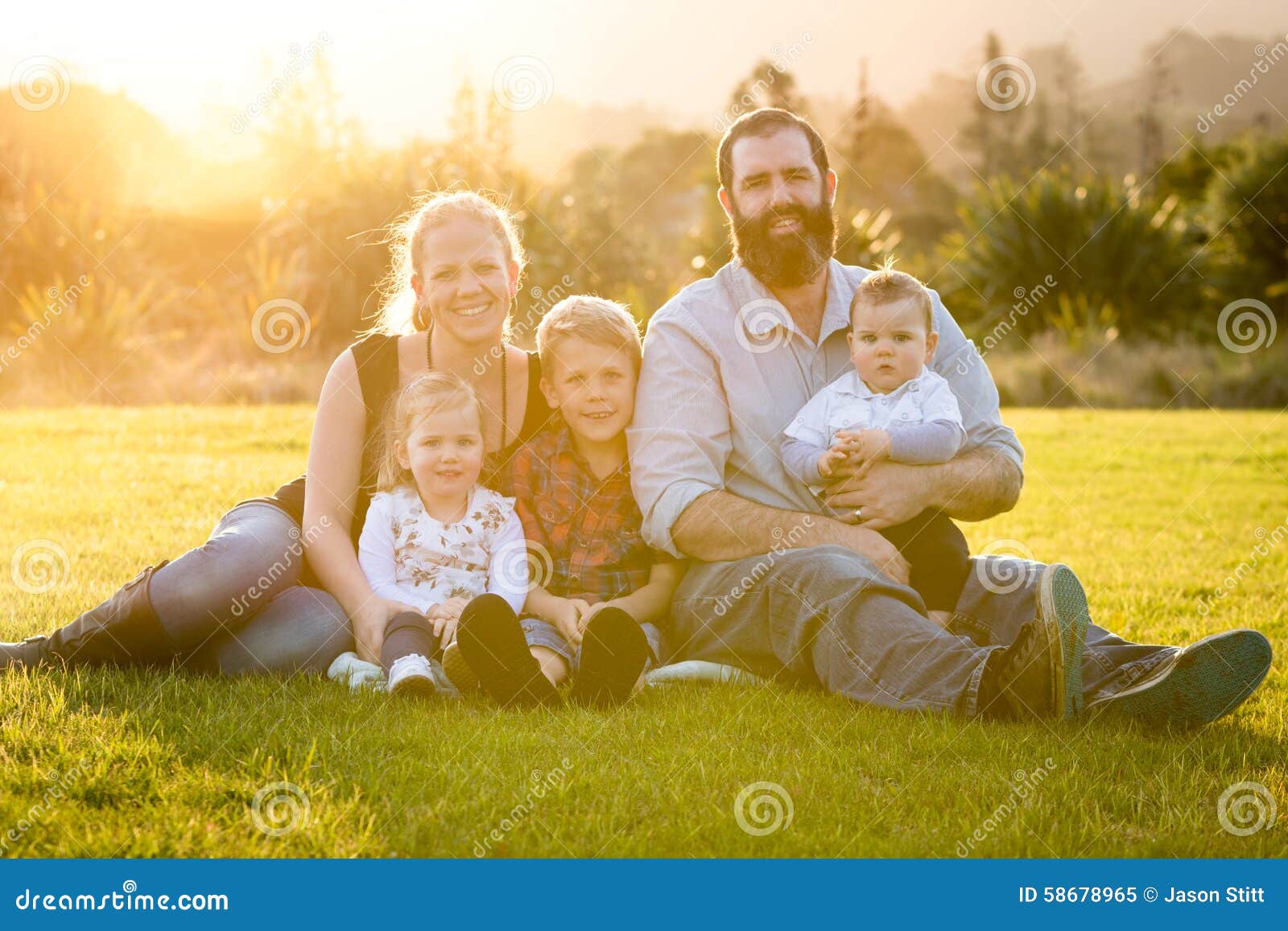 Smiling Family at Sunset stock image. Image of smiling - 58678965