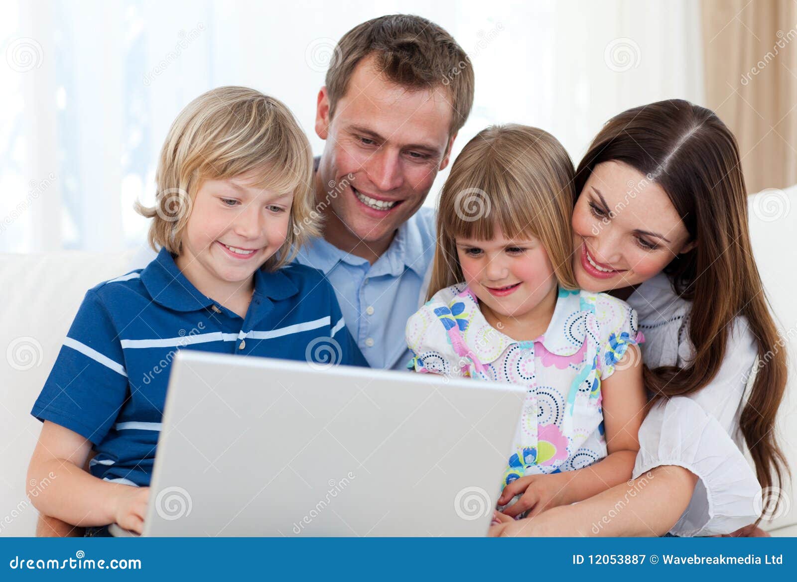 Smiling Family Using a Laptop Stock Image - Image of love, people: 12053887