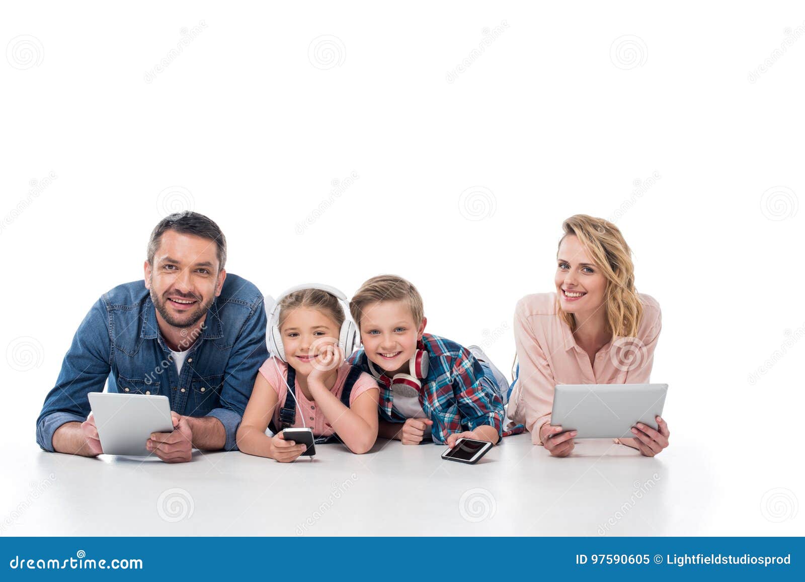Smiling Family with Various Digital Devices Looking at Camera Stock ...
