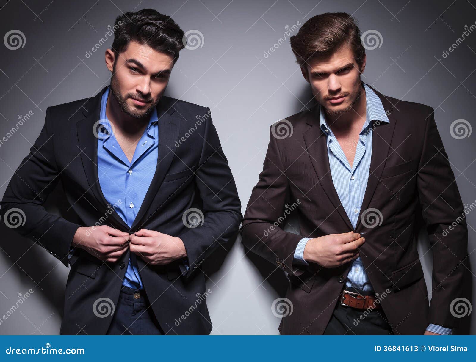 Smiling Fashion Men Buttoning Their Coats Stock Image - Image of pair ...