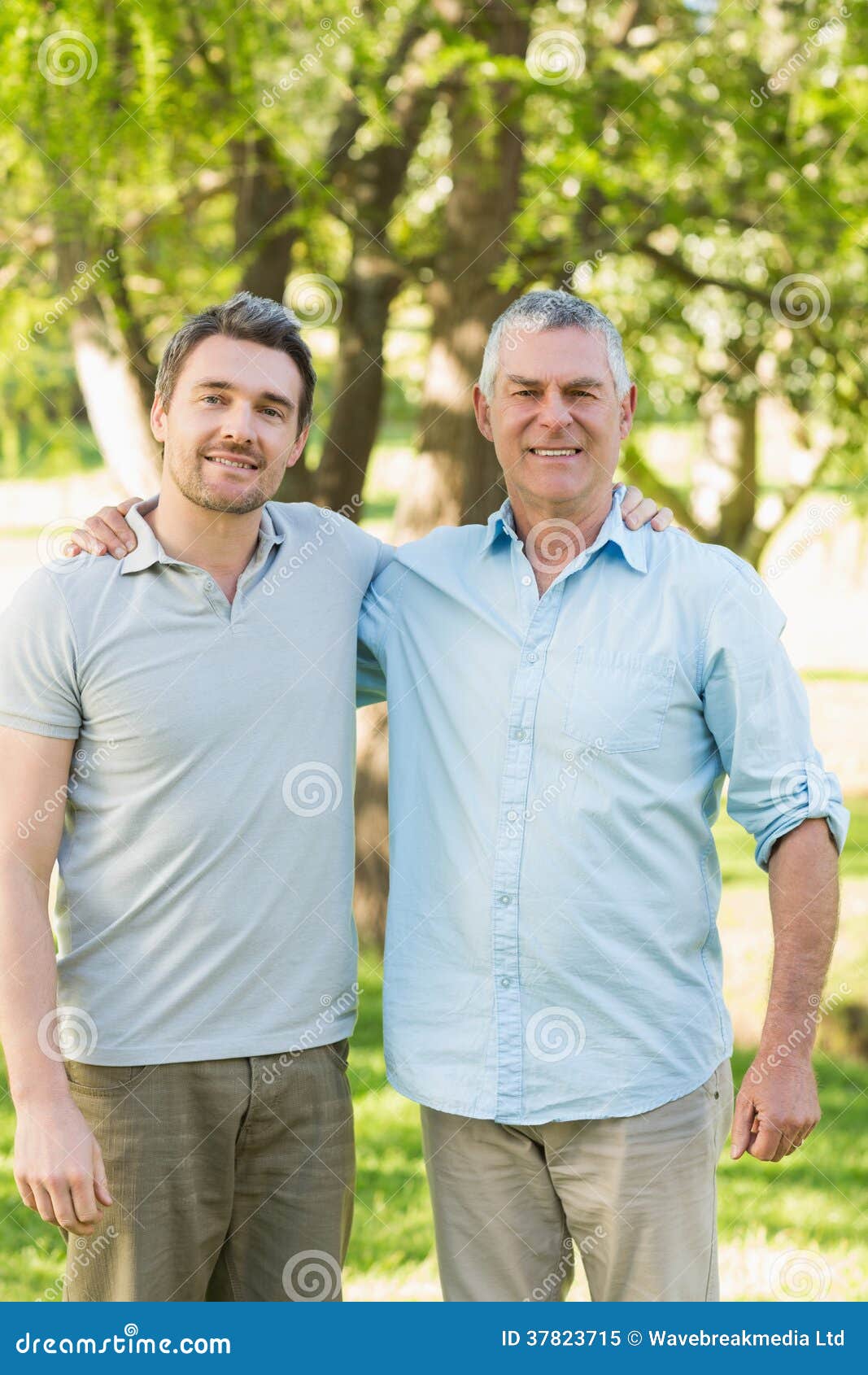 Smiling Father With Adult Son At Park Stock Image Image Of
