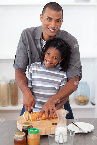 Smiling Father and His Son Cutting Bread Stock Image - Image of lunch ...