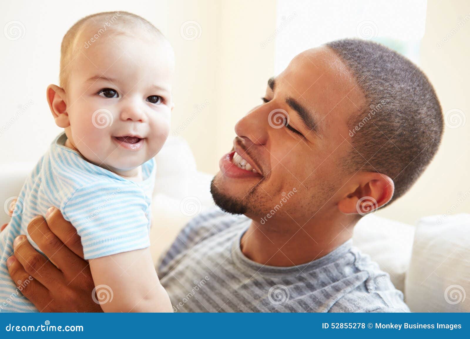 Smiling Father Playing with Baby Son at Home Stock Photo - Image of ...
