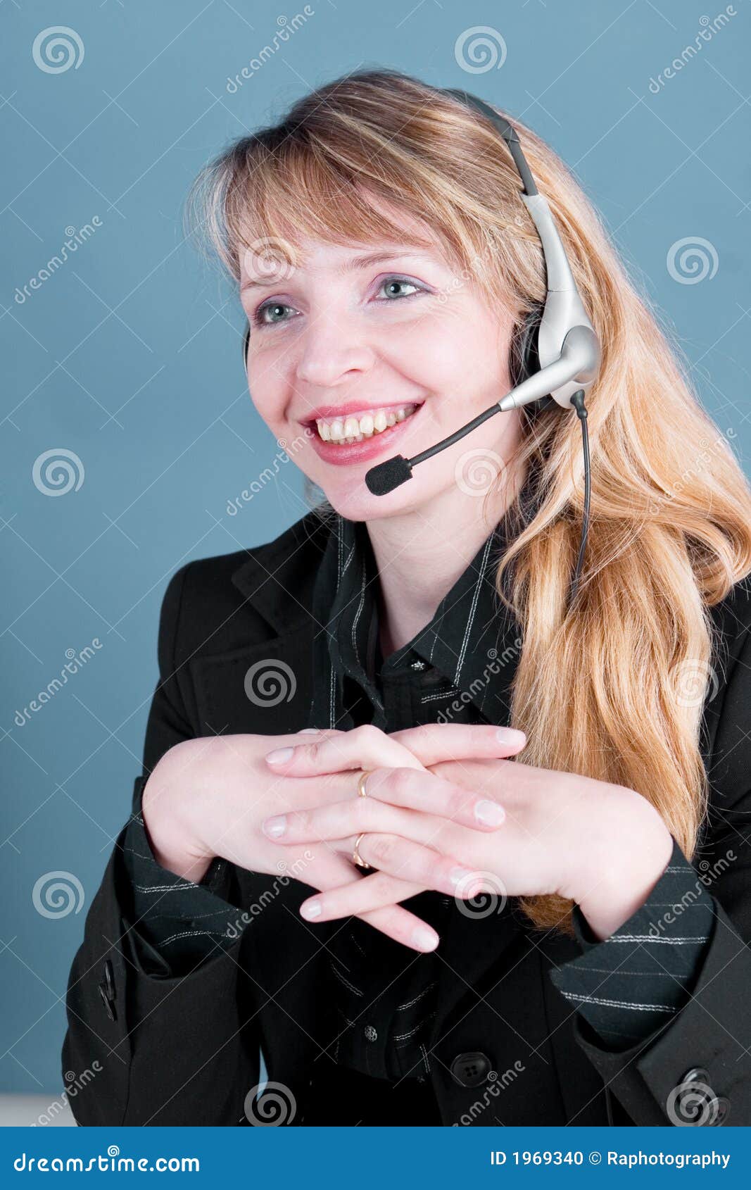 A Smiling Female Answering the Telephone Stock Photo - Image of ...