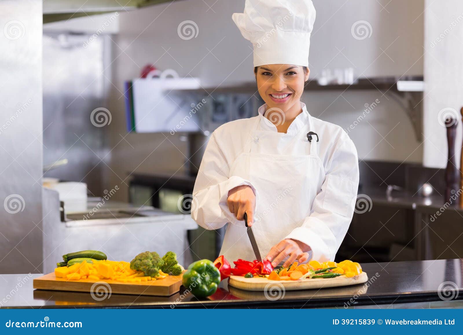 Smiling Female Chef Cutting Vegetables in Kitchen Stock Image - Image ...