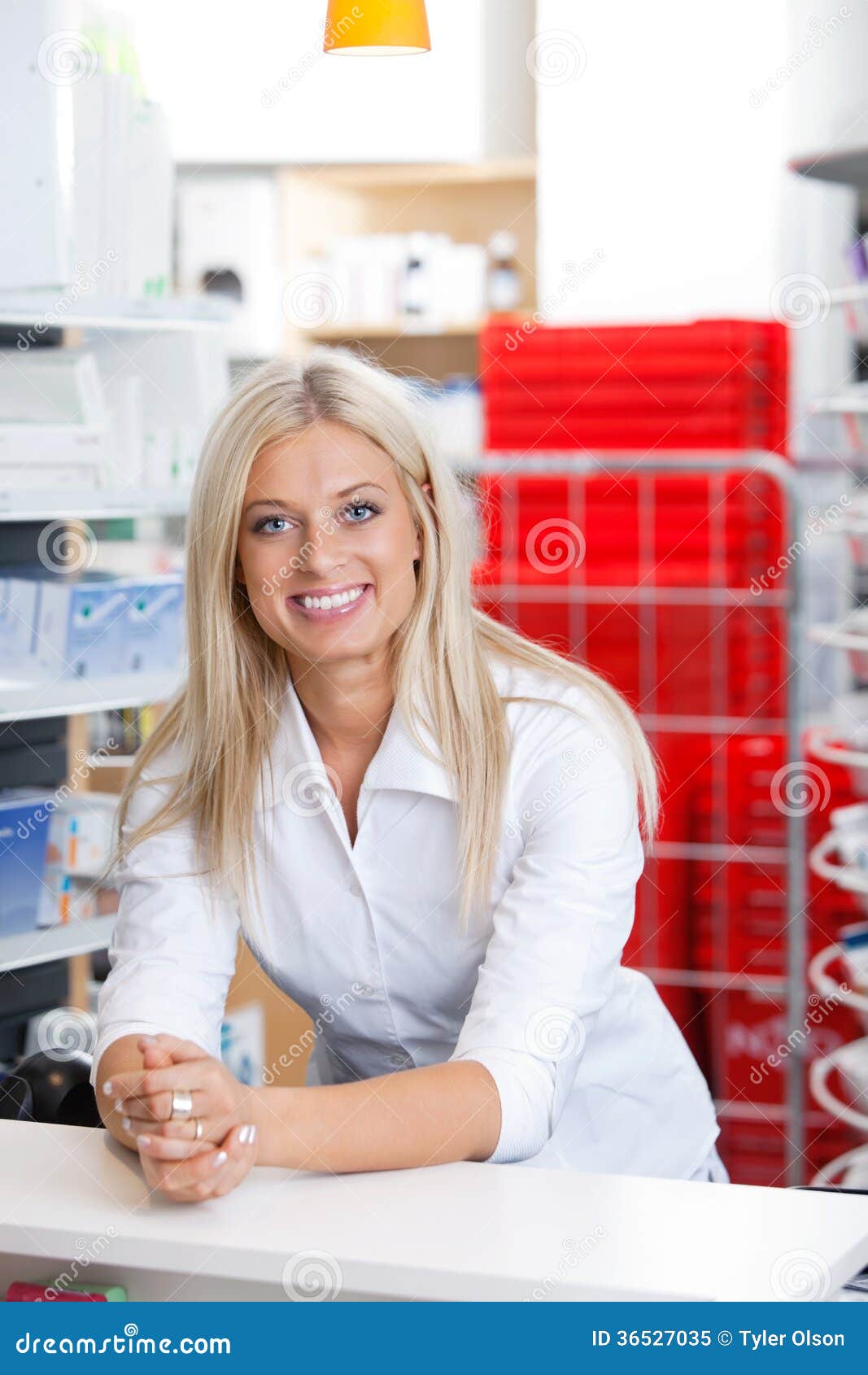 Smiling Female Chemist at Counter Stock Image - Image of counter ...