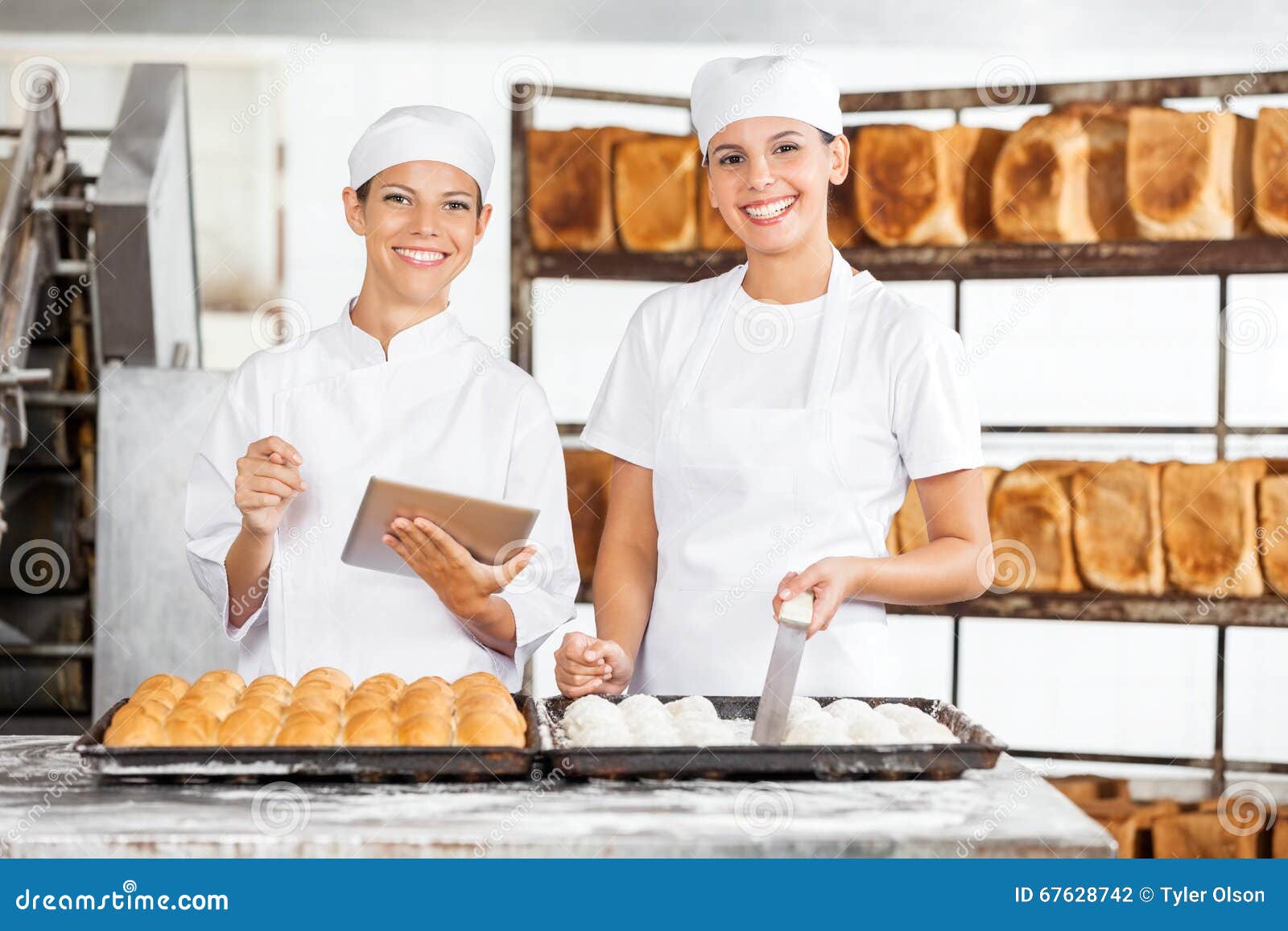 Smiling Female Colleagues with Digital Tablet in Bakery Stock Photo ...