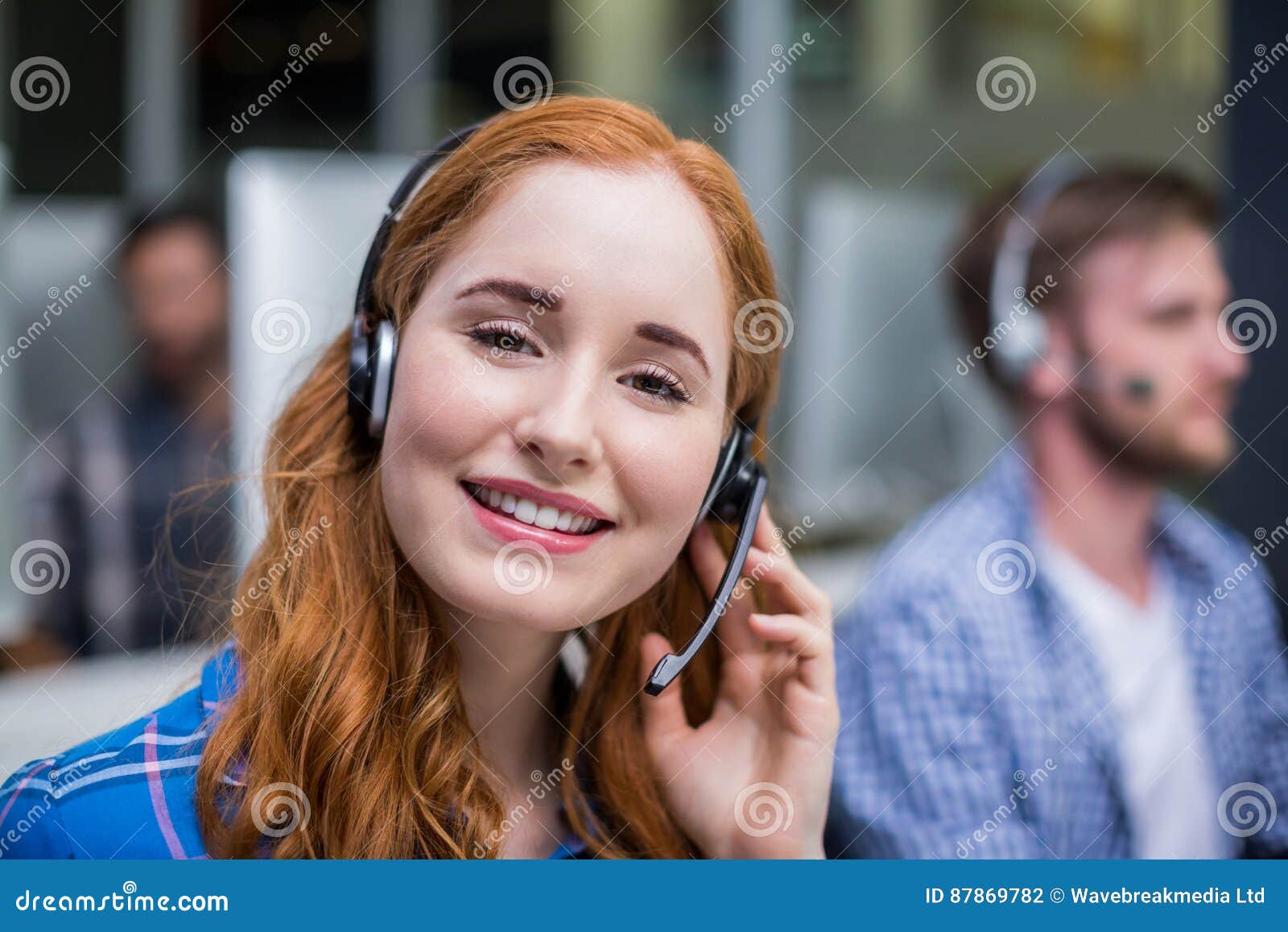 Smiling Female Customer Service Executive Talking on Headset at Desk ...