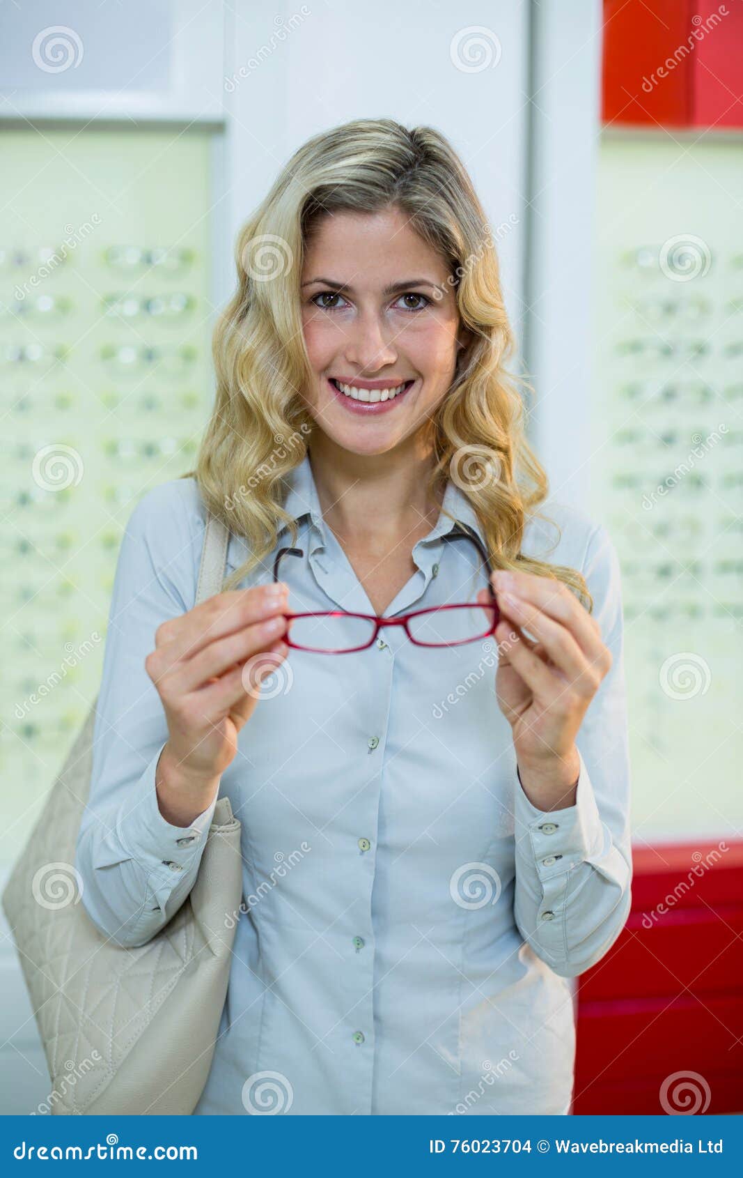 Smiling Female Customer Trying Spectacles Stock Photo - Image of ...