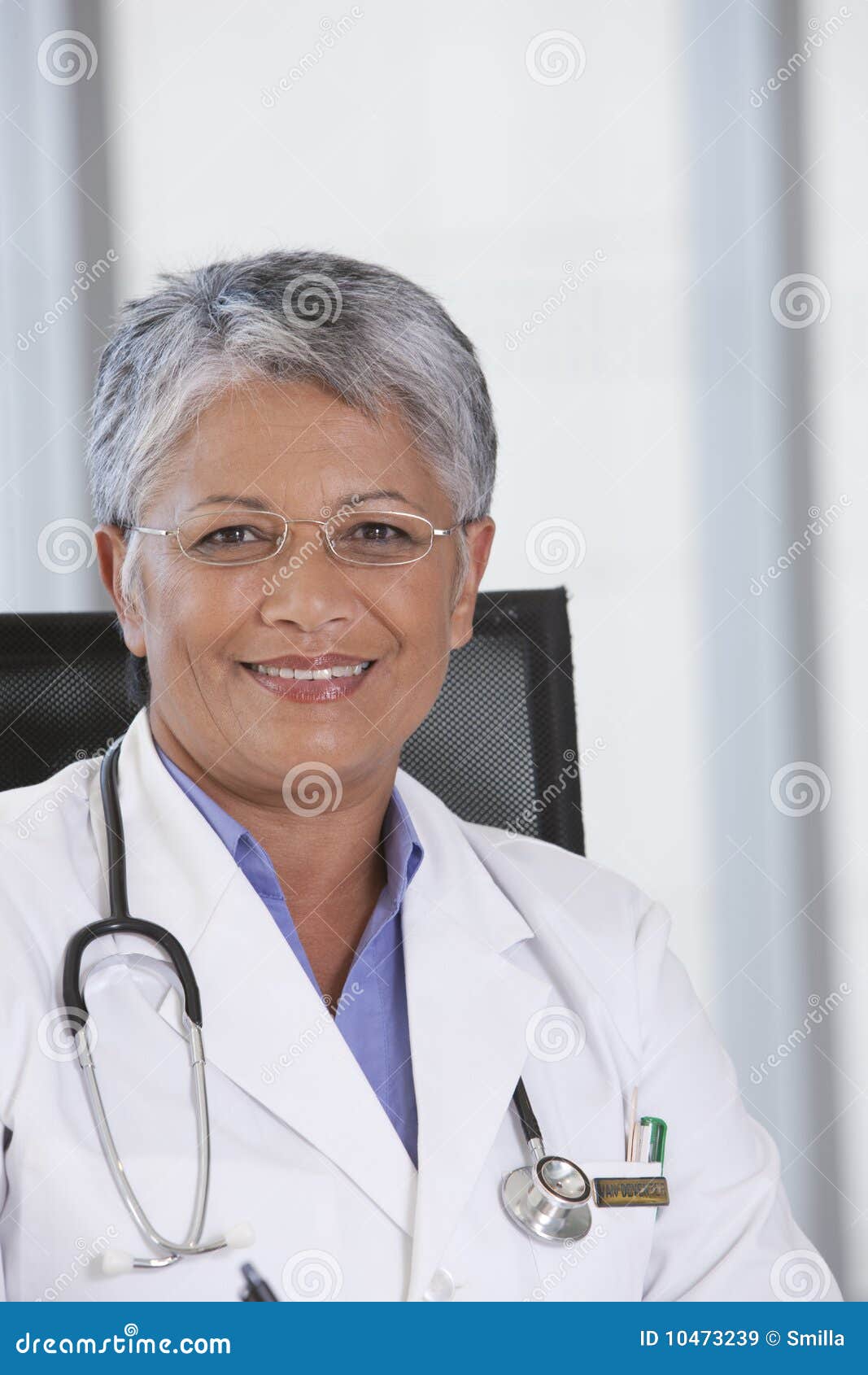 Smiling female doctor stock image. Image of mature, reliability - 10473239
