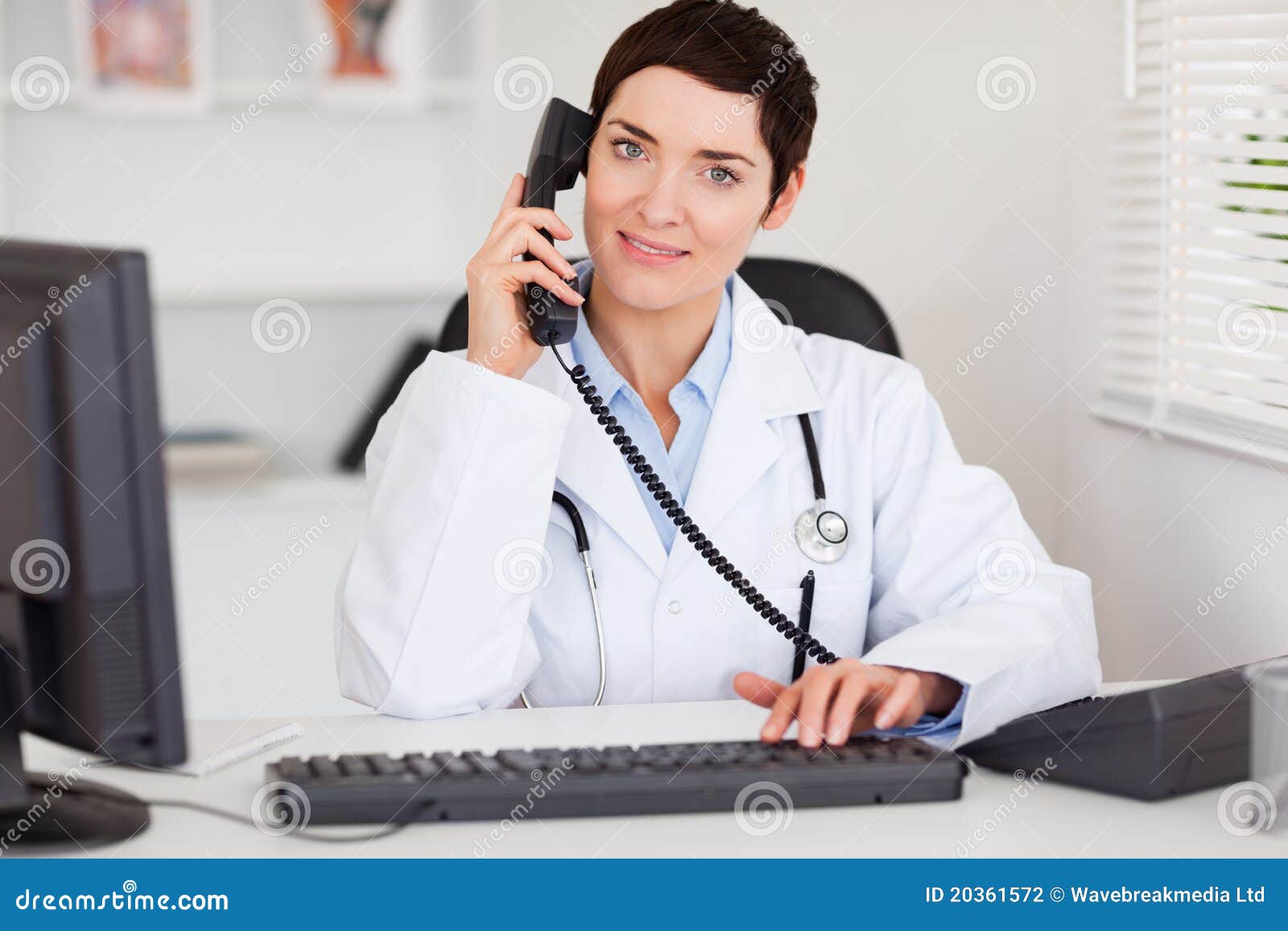 Smiling Female Doctor Making a Phone Call Stock Photo - Image of ...