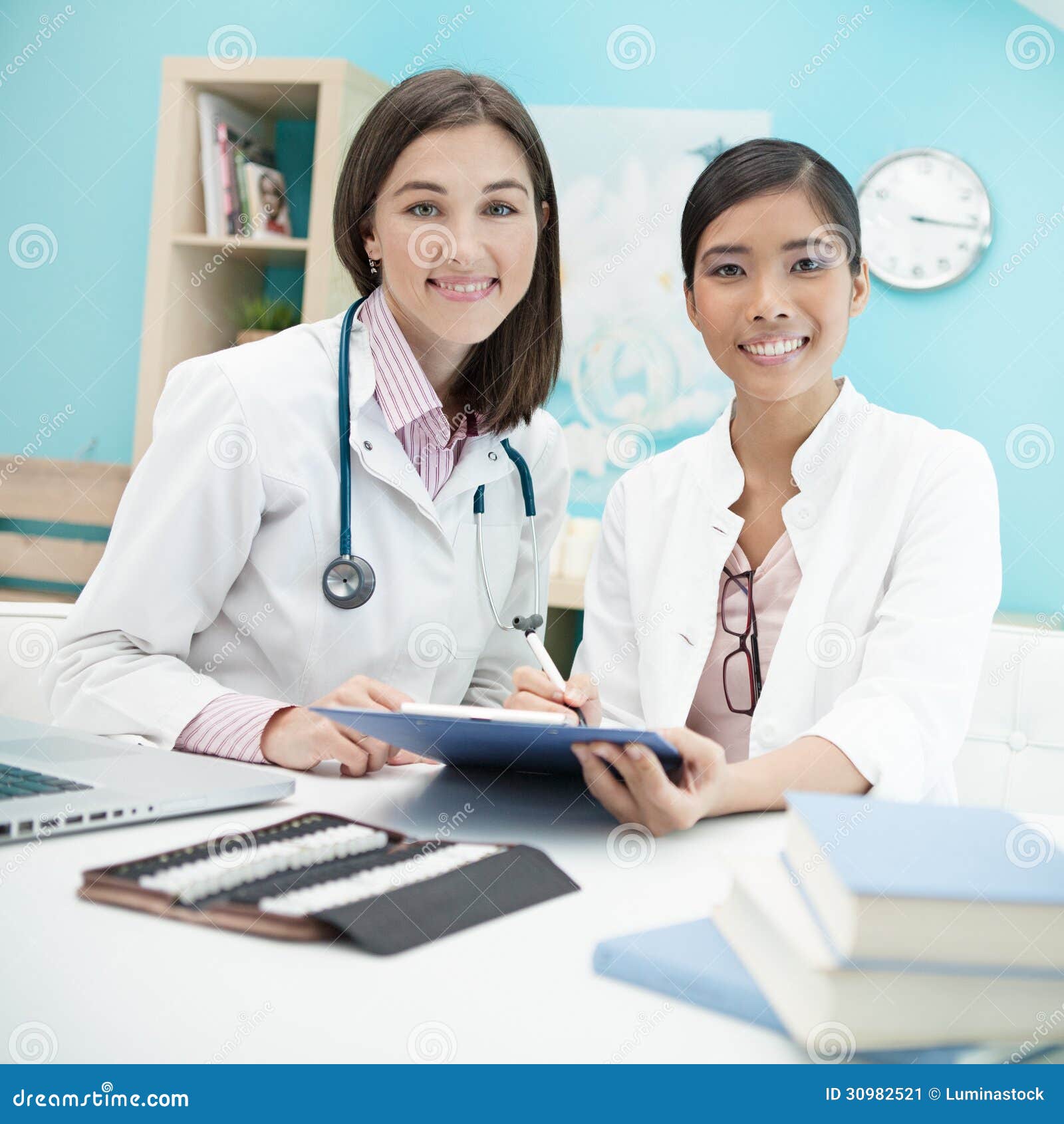 Smiling Female Doctors stock image. Image of portrait - 30982521