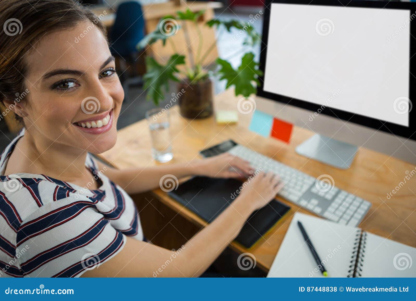 Smiling Female Graphic Designer Working on Computer Stock Photo - Image ...