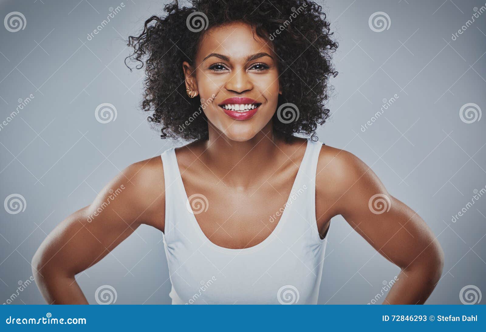 Smiling Female Leaning Forward on Gray Background Stock Image - Image ...