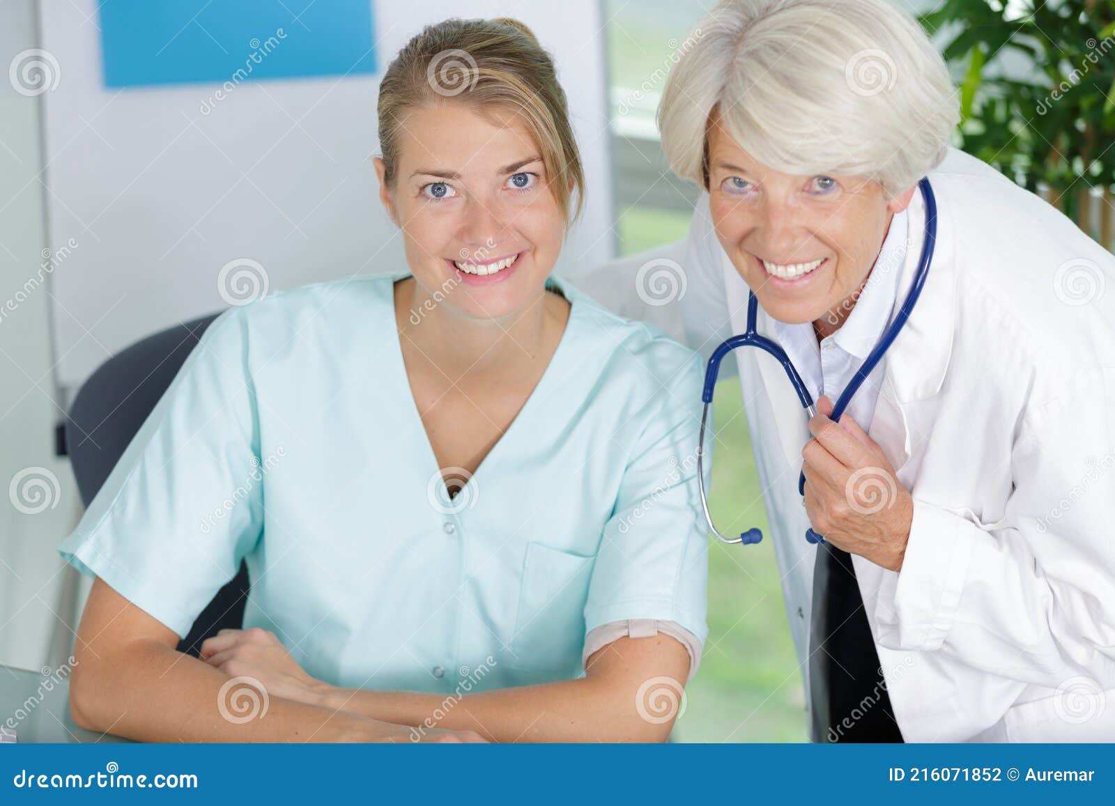 Smiling Female Physiotherapist and Doctor Stock Photo - Image of ...