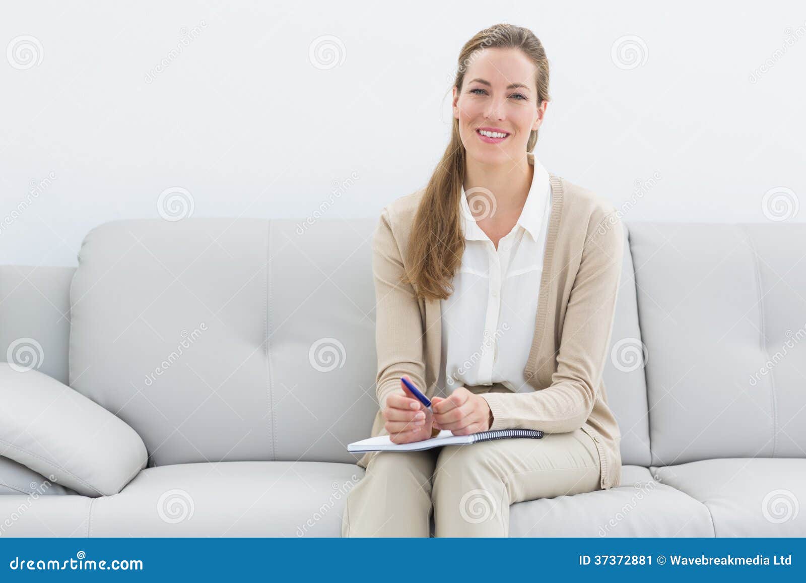 Smiling Female Psychologist Sitting on Sofa Stock Image - Image of ...