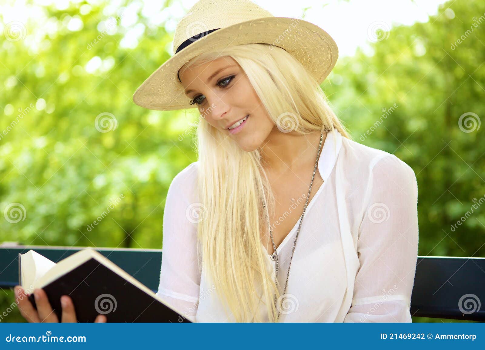 Smiling female reading stock photo. Image of person, college - 21469242