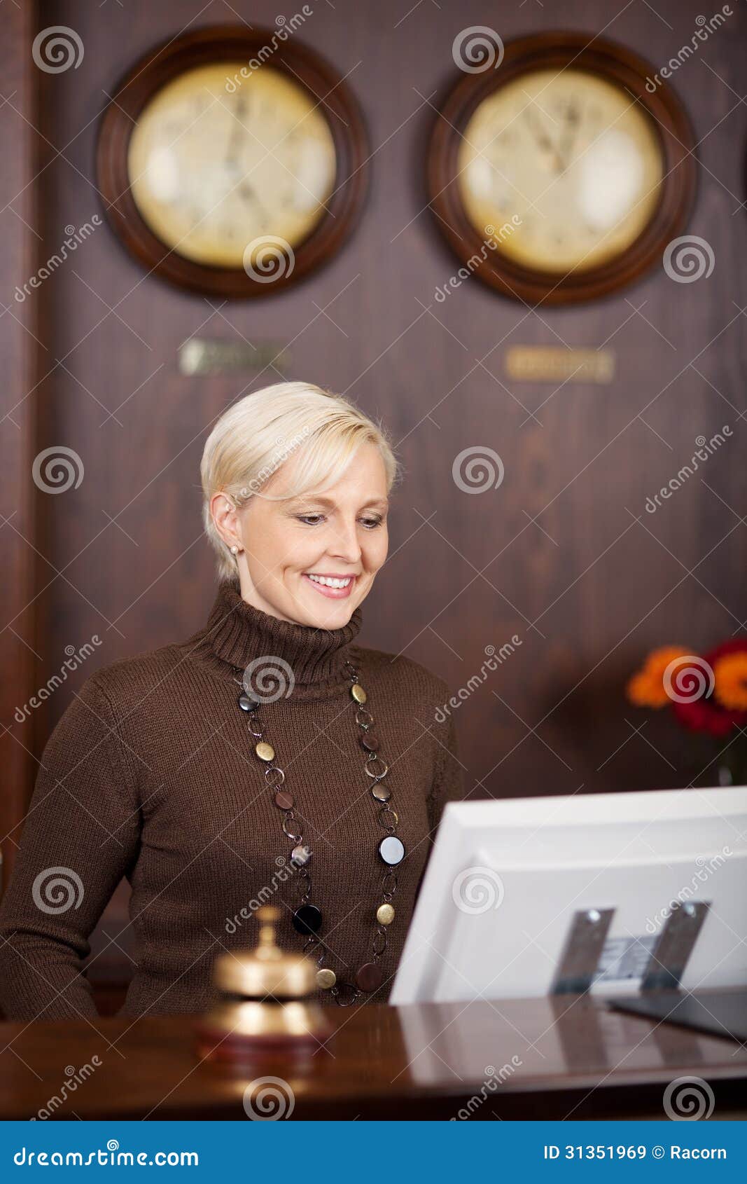 Smiling Female Receptionist at Hotel Counter Stock Image - Image of ...