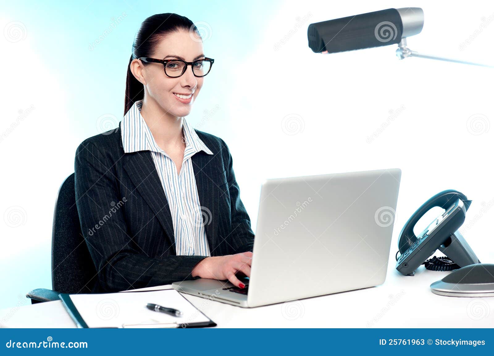Smiling Female Secretary Working on Laptop Stock Image - Image of phone ...
