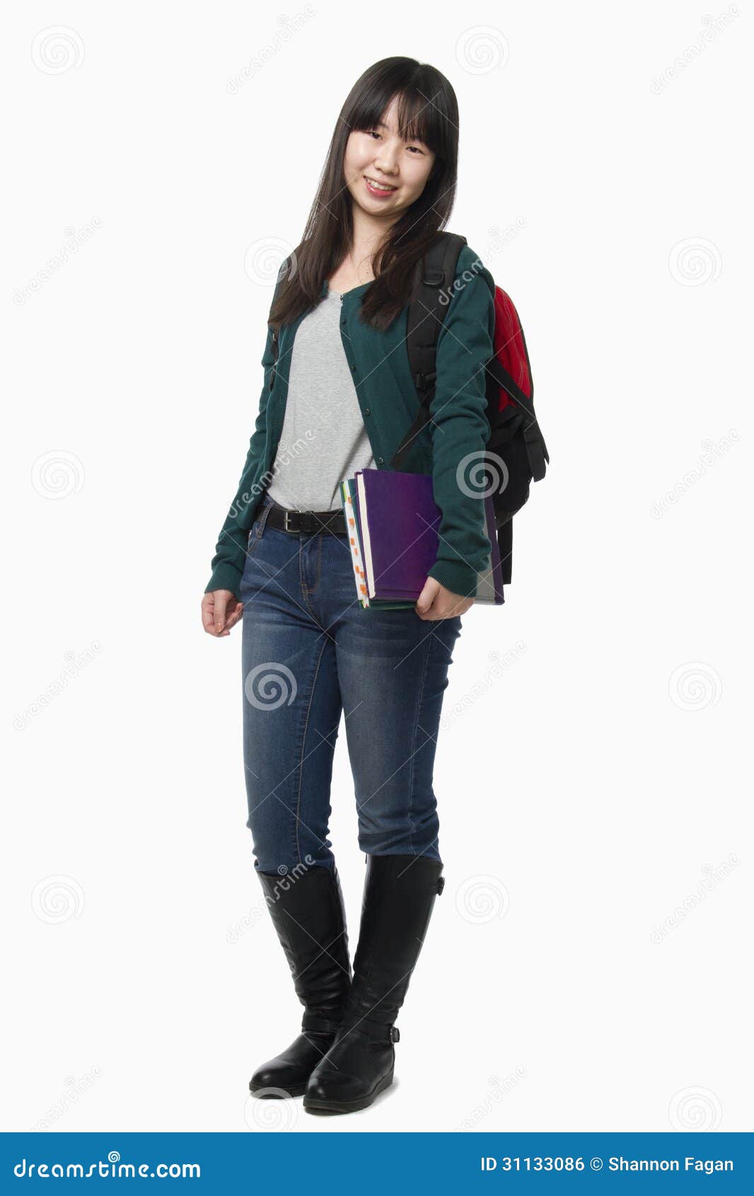 Smiling Female Student Carrying Books with Backpack, Looking at Camera ...